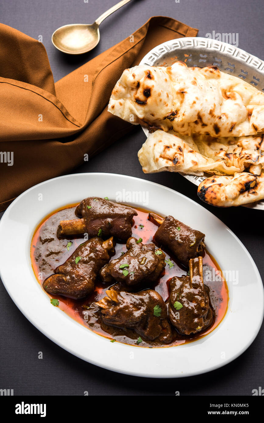 lamb shank or mutton or gosht paya or khoor curry served with indian ...