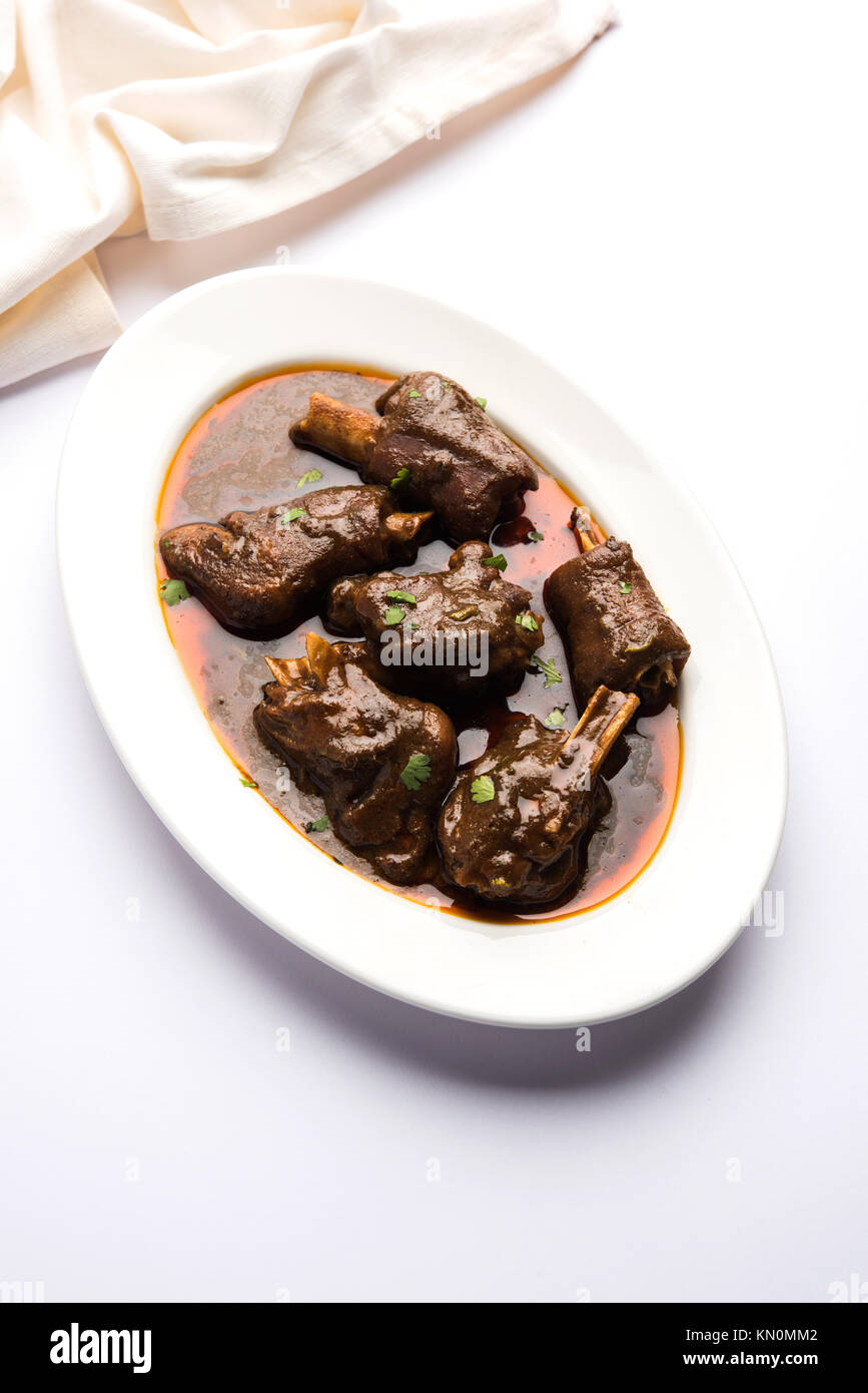 lamb shank or mutton or gosht paya or khoor curry served with indian ...