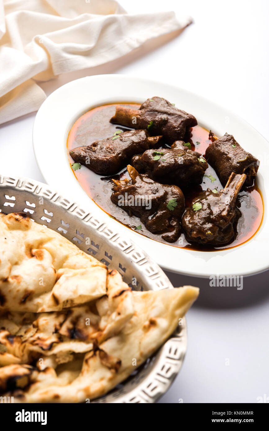 lamb shank or mutton or gosht paya or khoor curry served with indian ...