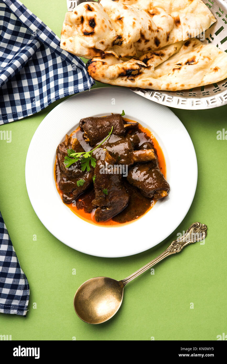 lamb shank or mutton or gosht paya or khoor curry served with indian ...