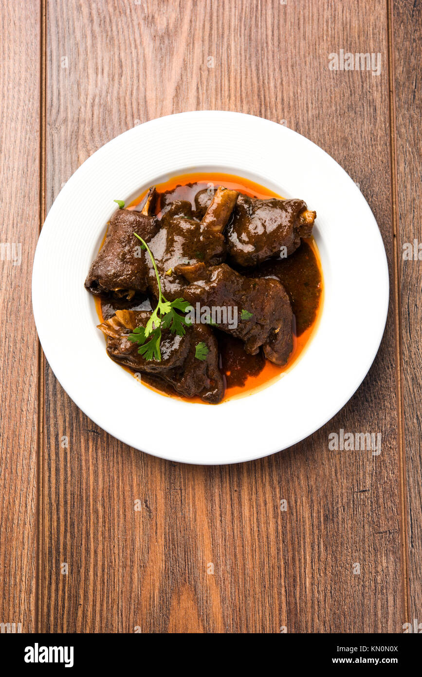 lamb shank or mutton or gosht paya or khoor curry served with indian ...