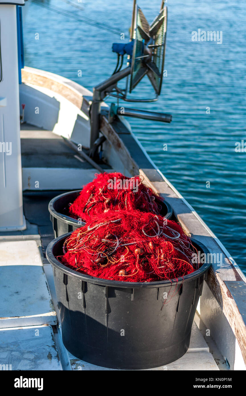 Fishing net on a small fishing boat Stock Photo - Alamy