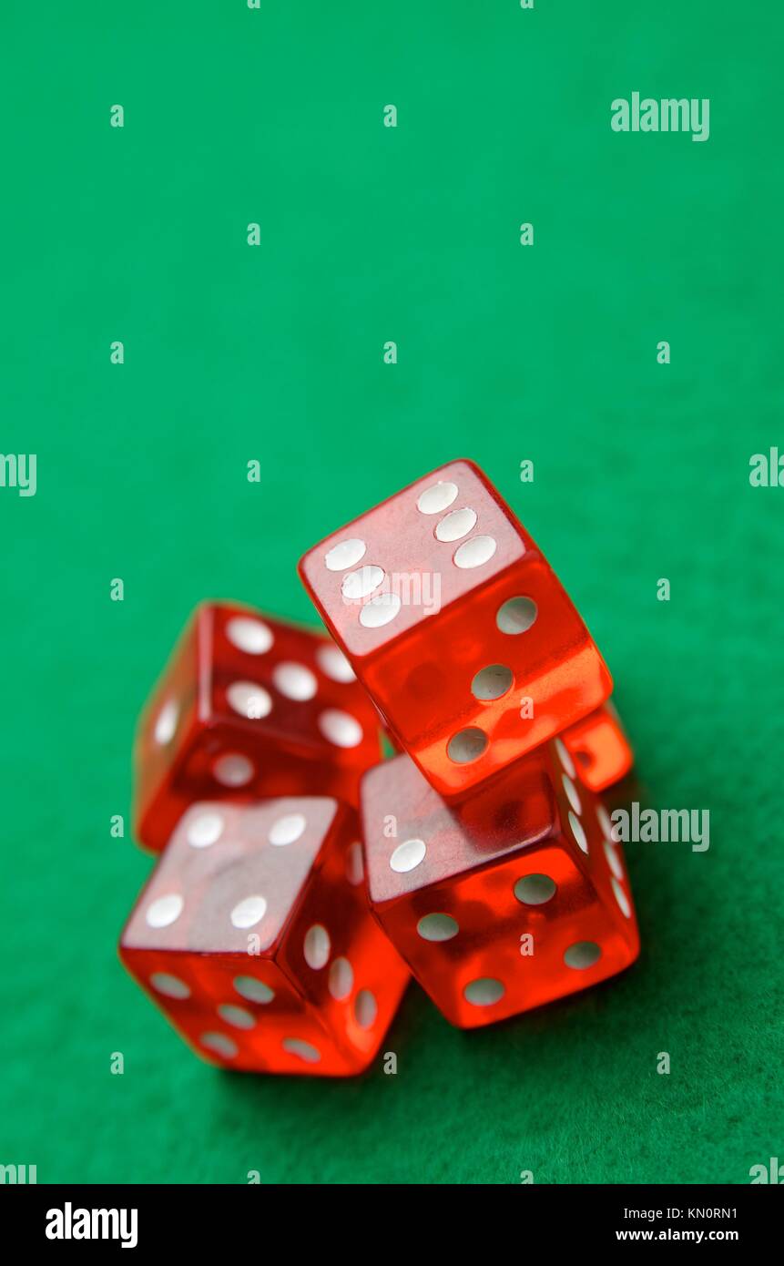 group dice game on a carpet of green Stock Photo - Alamy