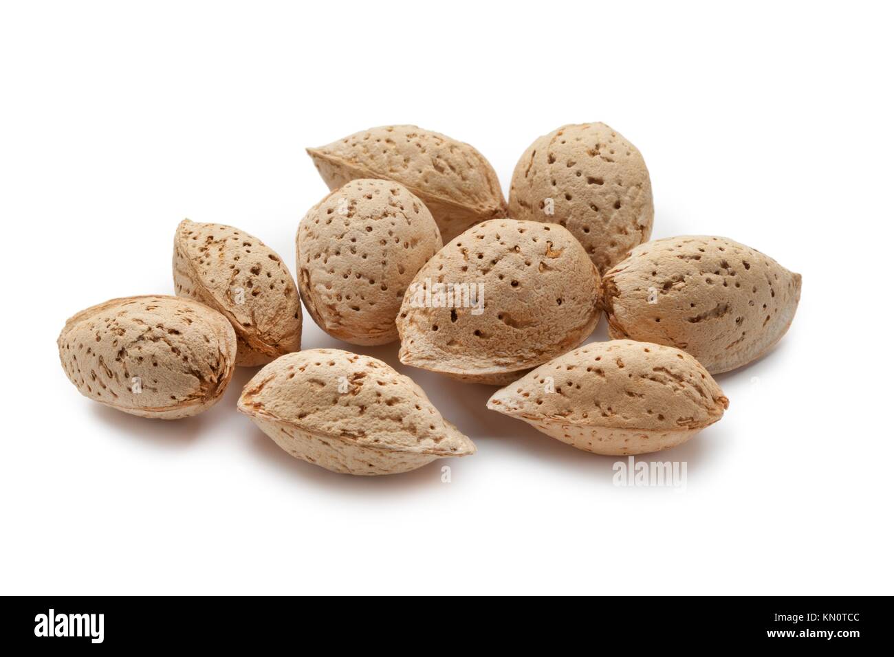 Almonds in the pod on white background Stock Photo - Alamy