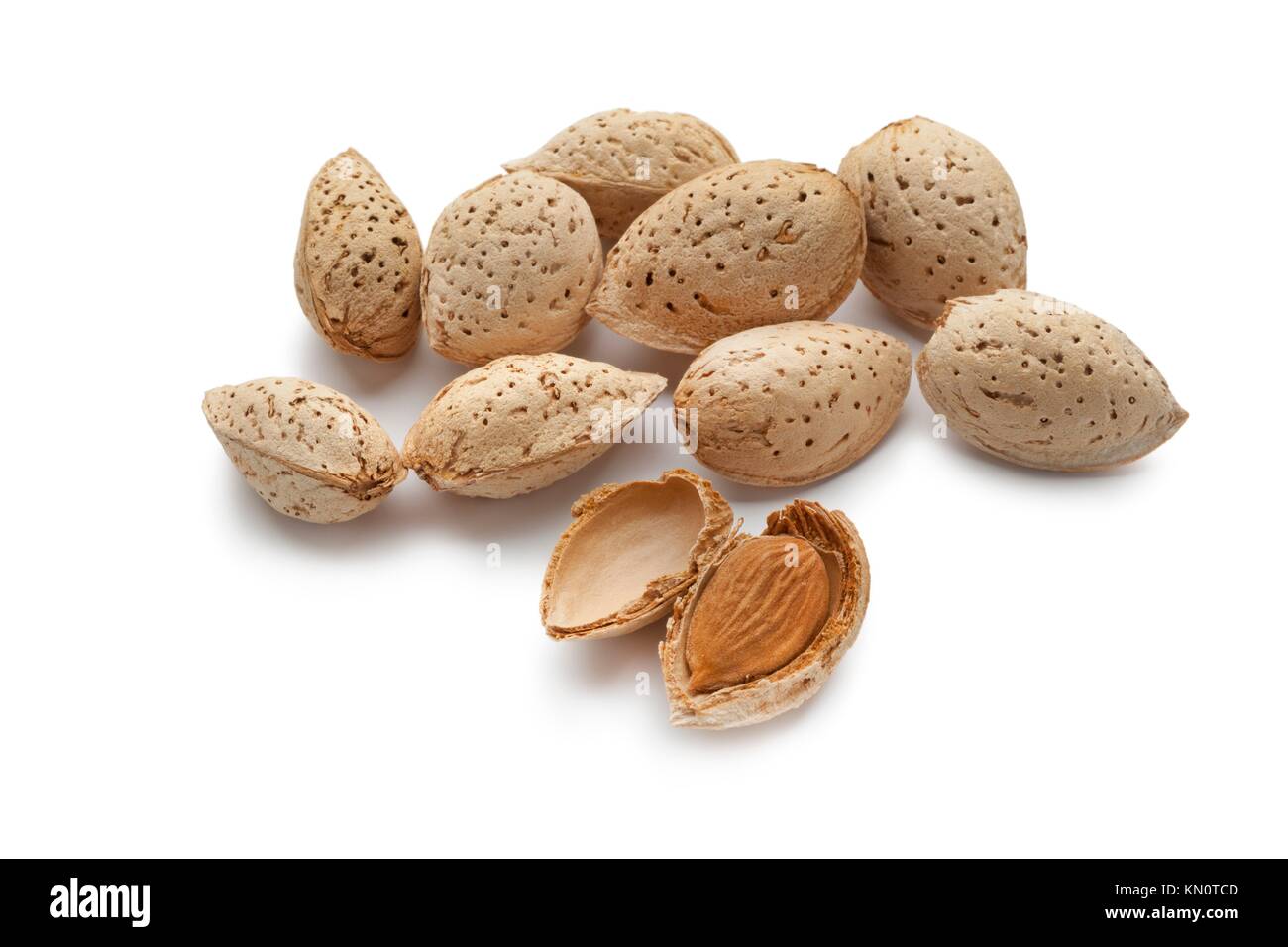 Almonds in the pod on white background Stock Photo - Alamy