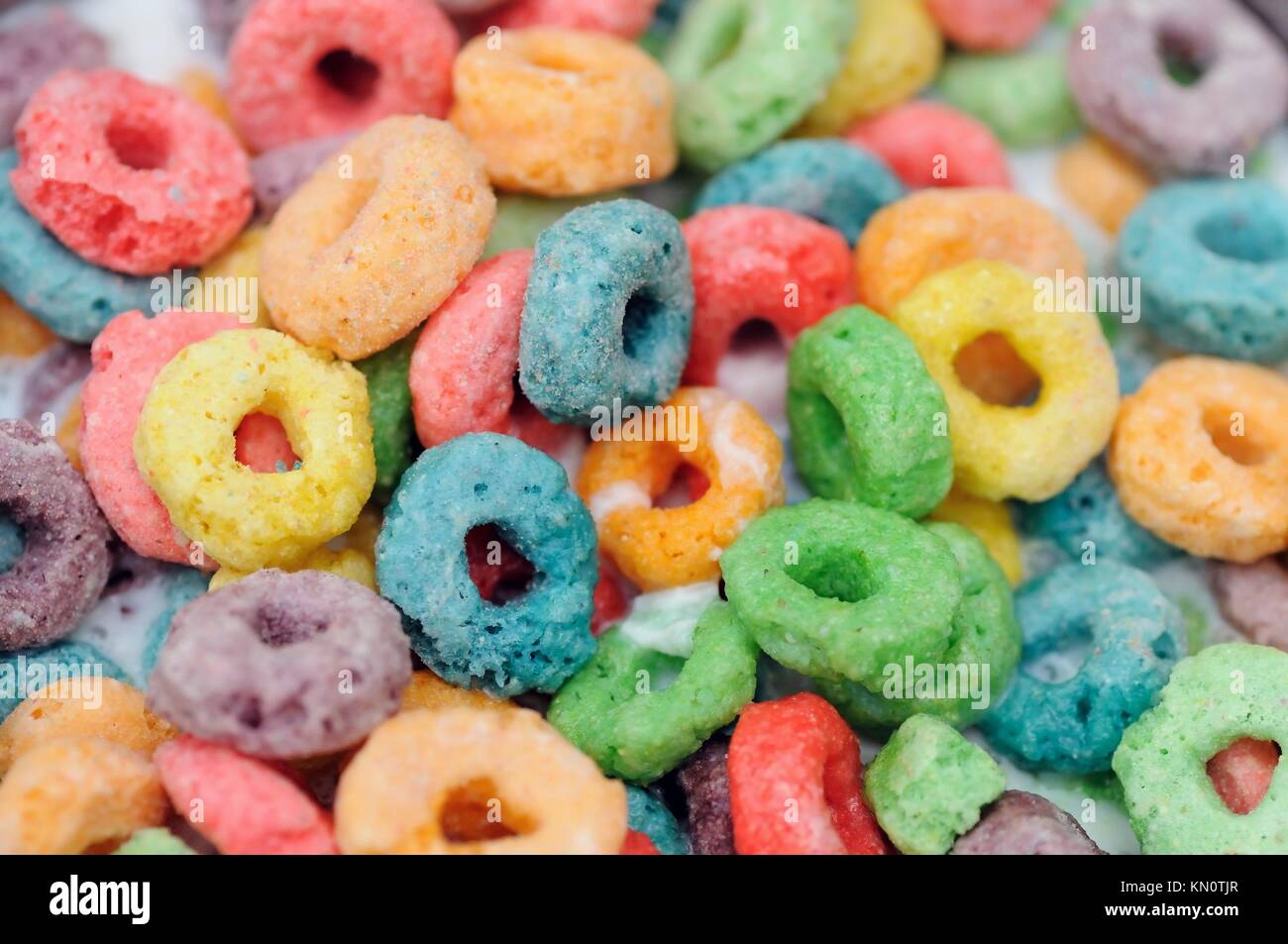 orange, blue, green and purple cereal fruits Stock Photo - Alamy