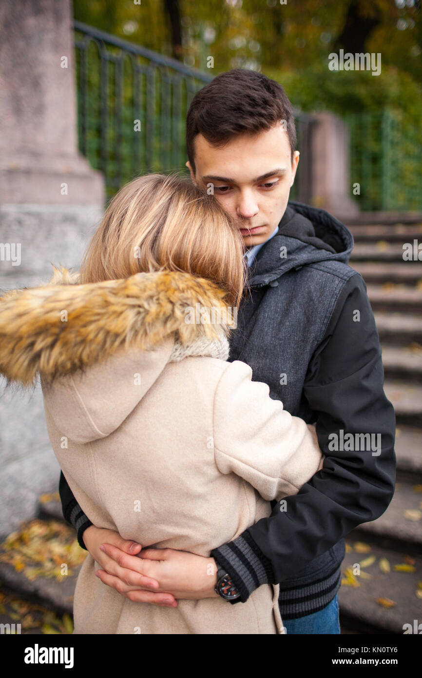 The guy with the girl cuddling in the Park on an autumn evening Stock ...
