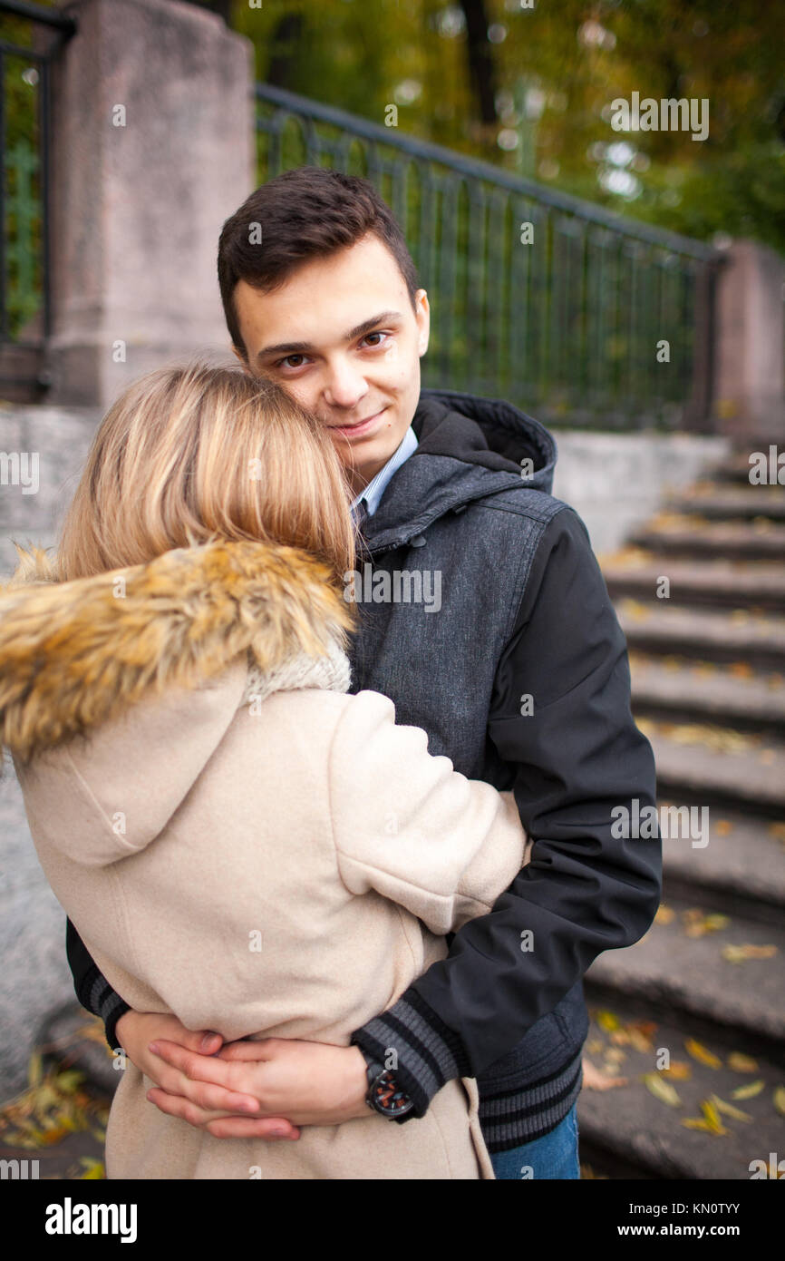 The guy with the girl cuddling in the Park on an autumn evening Stock ...