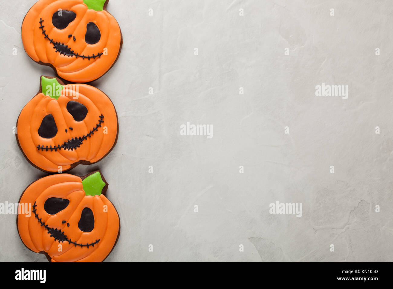 Homemade ginger cookies in the shape of pumpkins for Halloween. On the ...