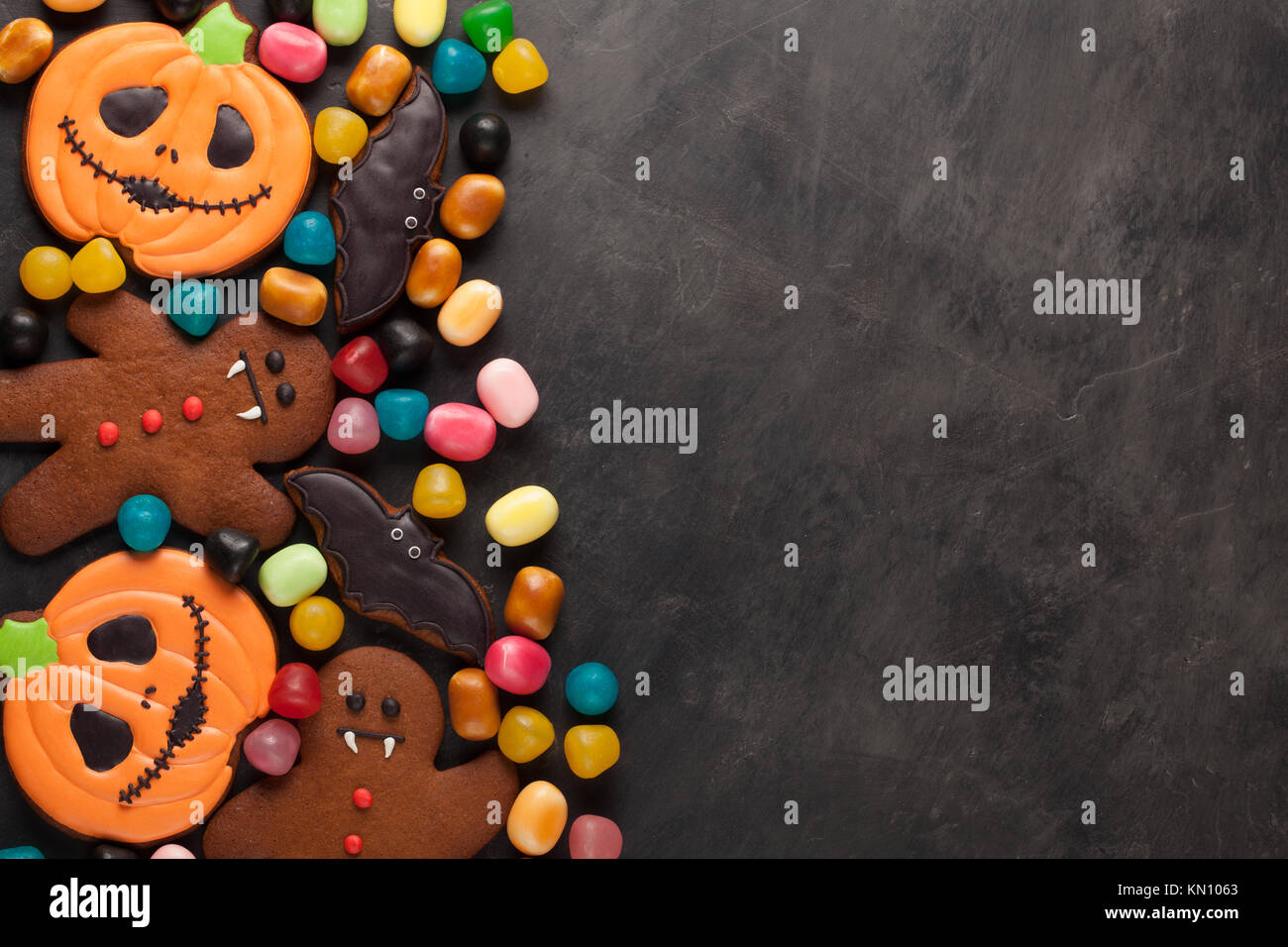 Halloween pumpkin, bat and gingerbread man-vampire cookies and colorful ...
