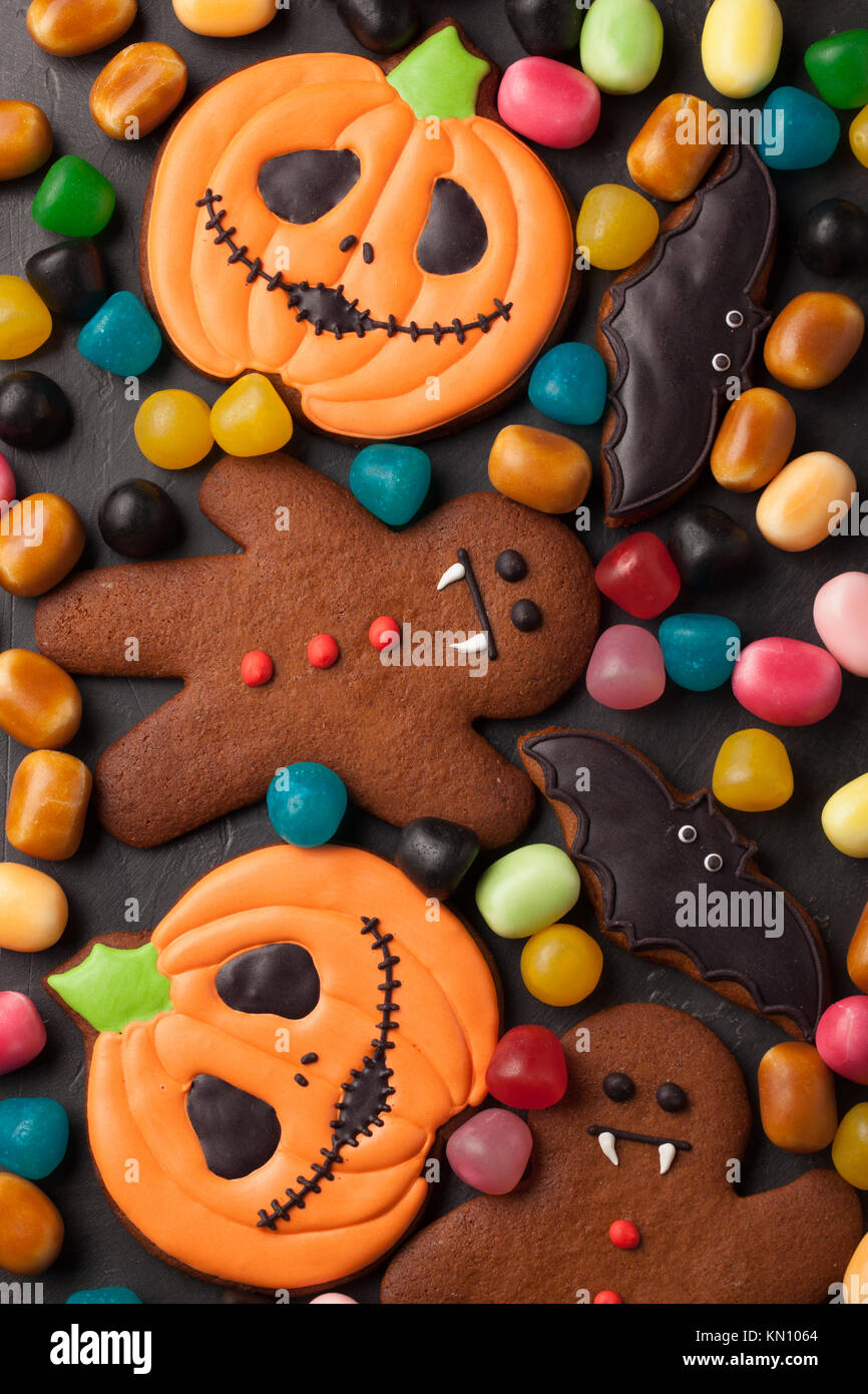 Halloween pumpkin, bat and gingerbread man-vampire cookies and colorful ...
