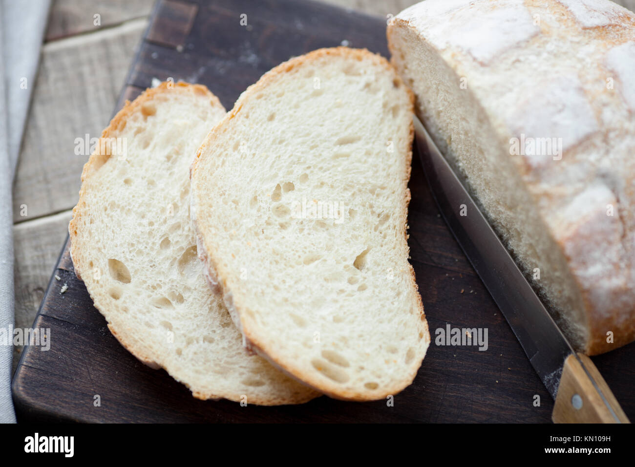 Sliced unleavened bread on a wooden table Stock Photo - Alamy
