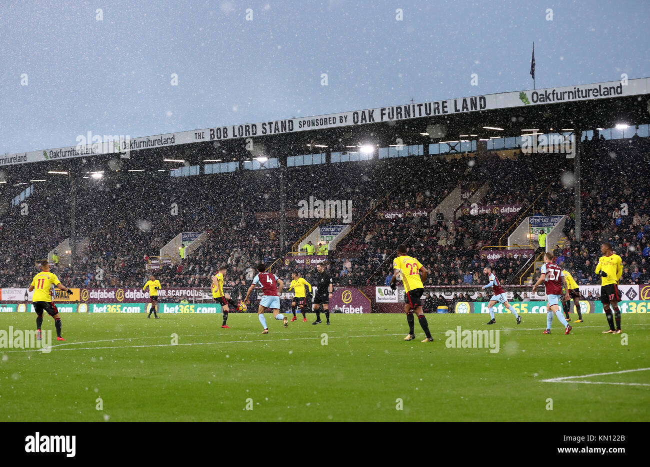 A general view as snow falls during the Premier League match at Turf ...