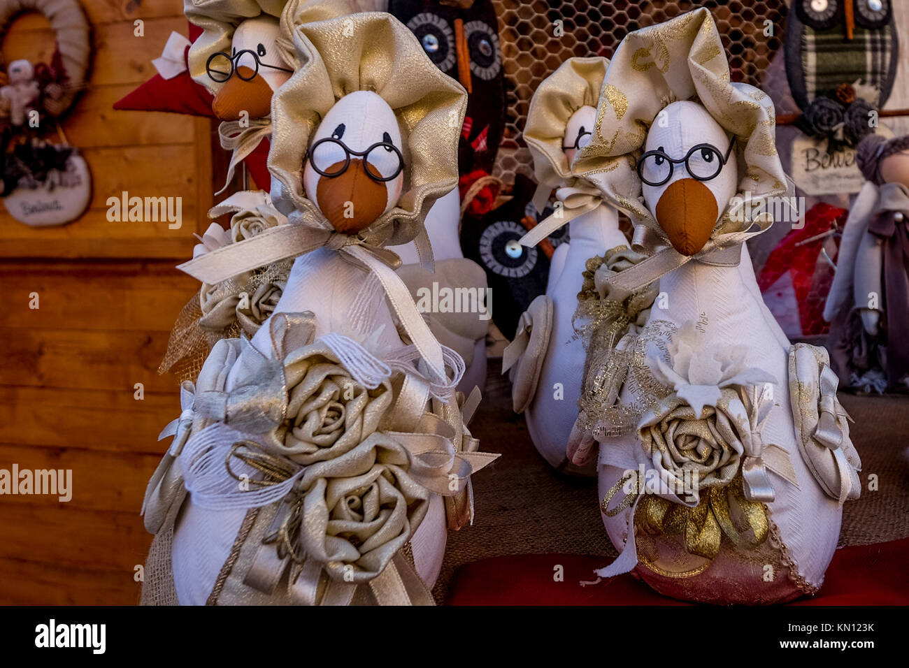 Two puppets depicting geese on display at the window of a market stall ...