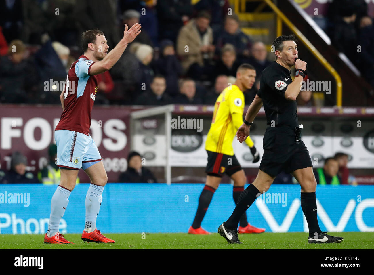 Burnley's Ashley Barnes (left) appeals to referee Lee Probert after ...