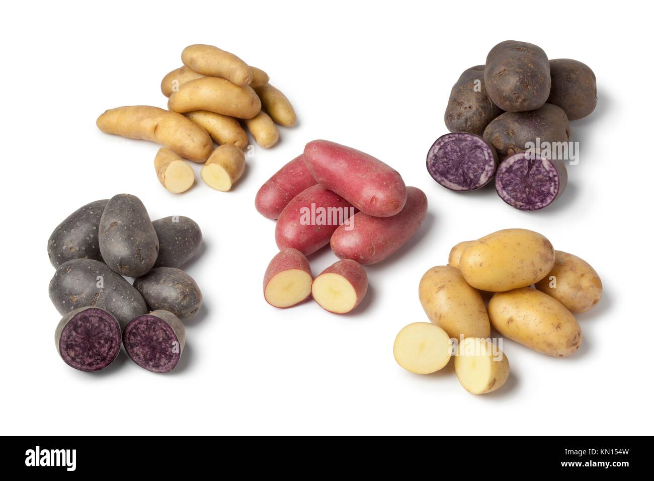 Variety of heirloom gourmet potatoes on white background Stock Photo ...