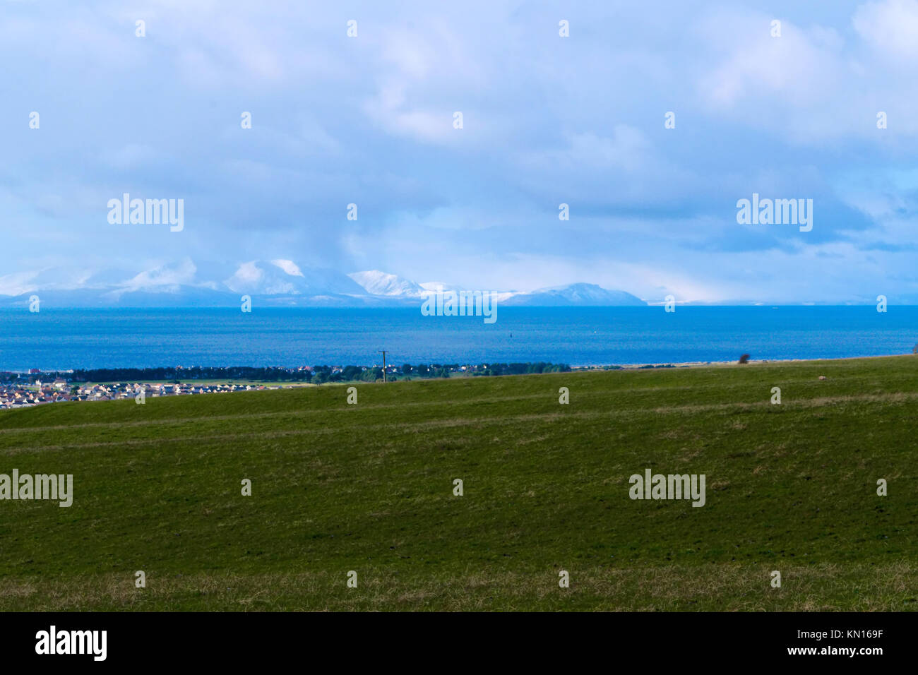 Snow covered mountains of Arran viewed across the Firth of Clyde from ...