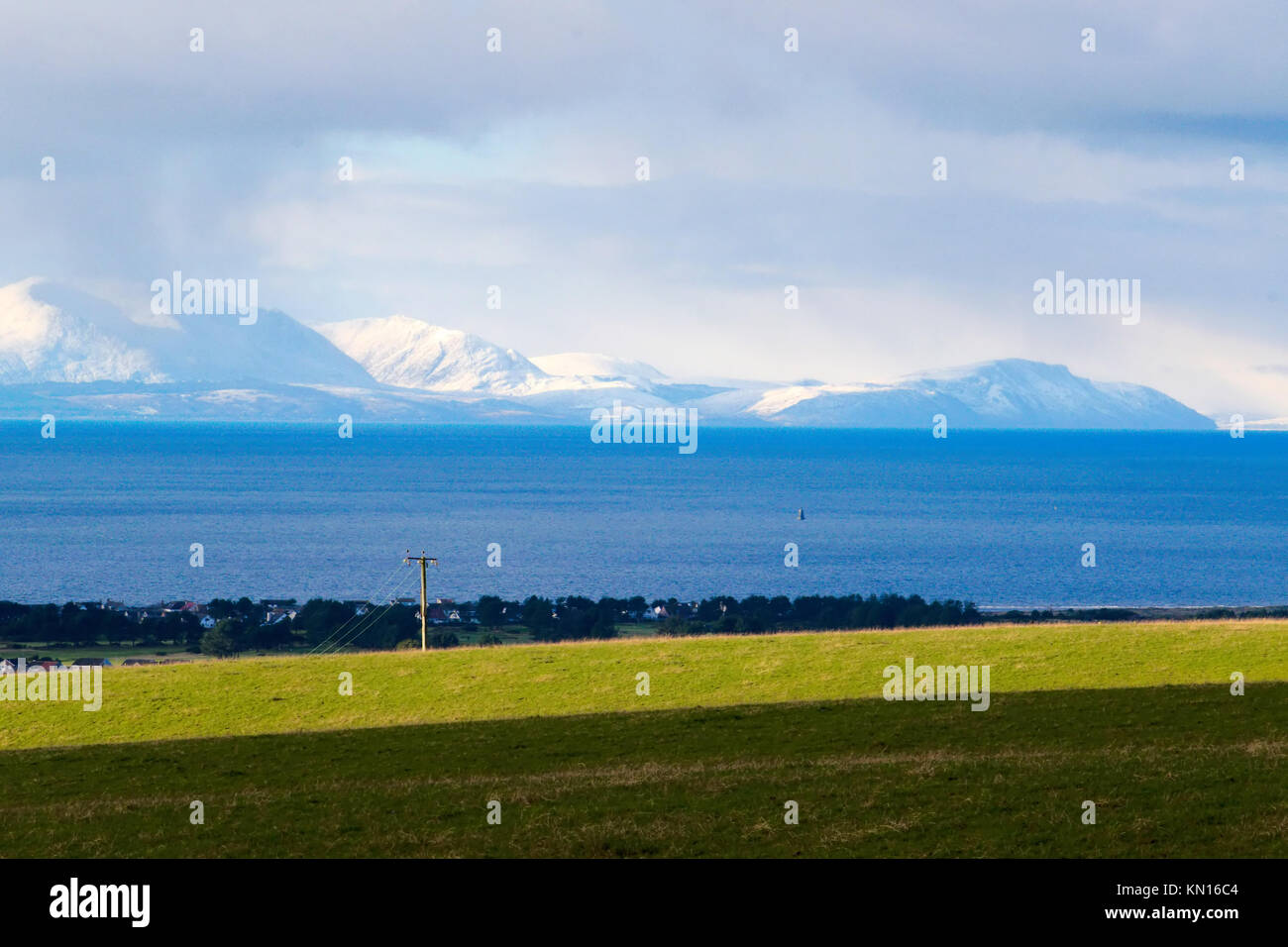 Snow covered mountains of Arran viewed across the Firth of Clyde from ...