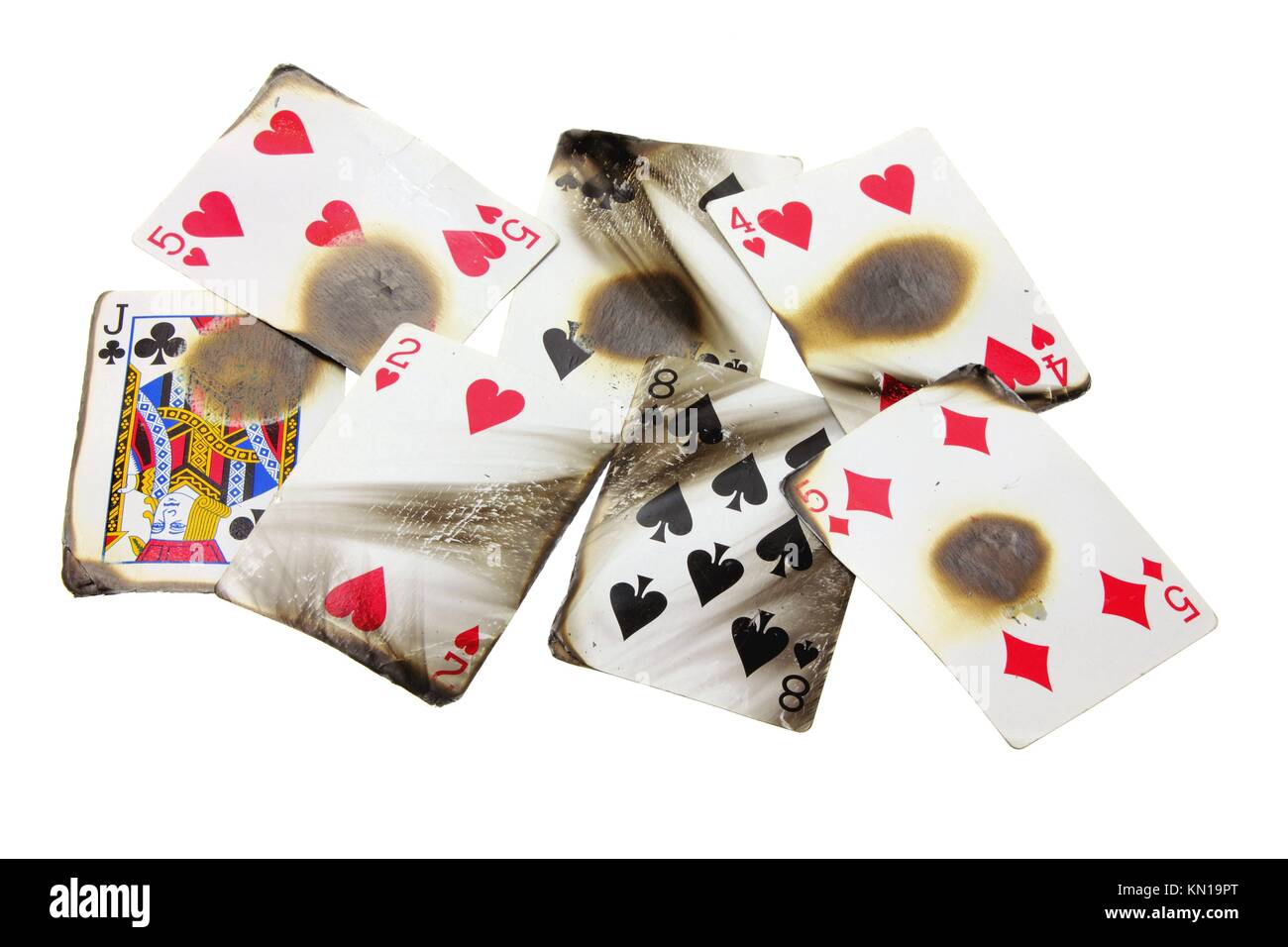 Burnt Playing Cards on White Background Stock Photo - Alamy