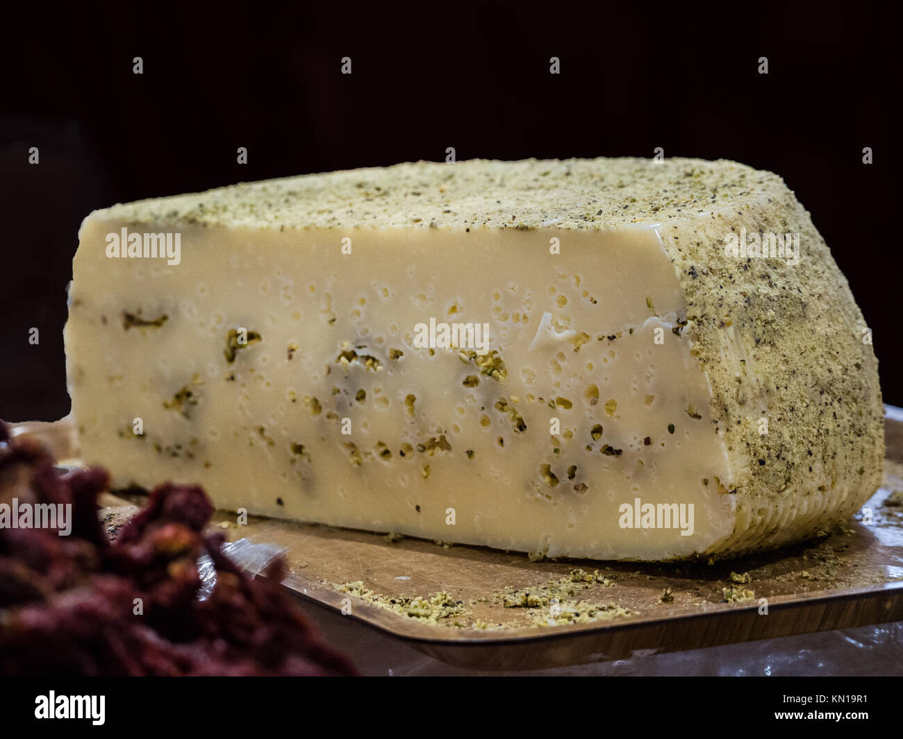 Sicilian aged cheese, flavored with pistachio Stock Photo - Alamy