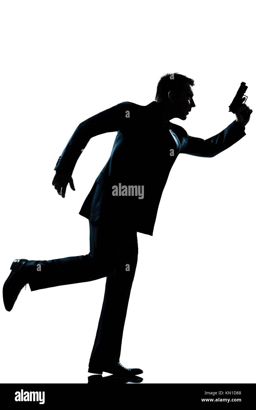 Man running suit gun hi-res stock photography and images - Alamy