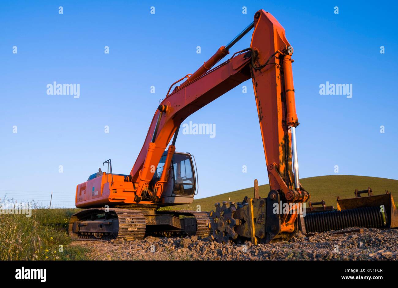 Orange Excavator, Northern California outdoors Stock Photo - Alamy