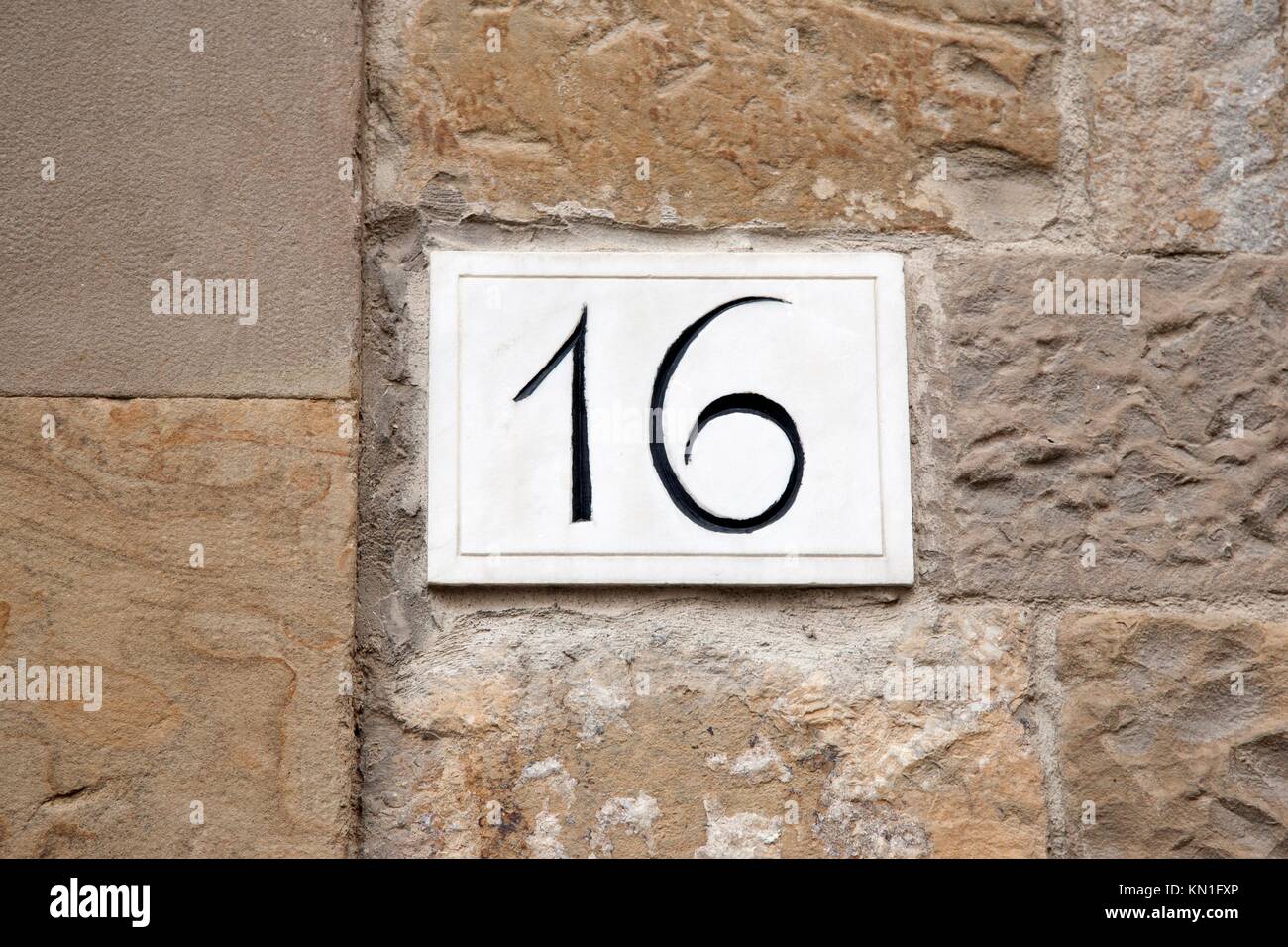 Number Sixteen on Plaque on Stone Wall Stock Photo - Alamy