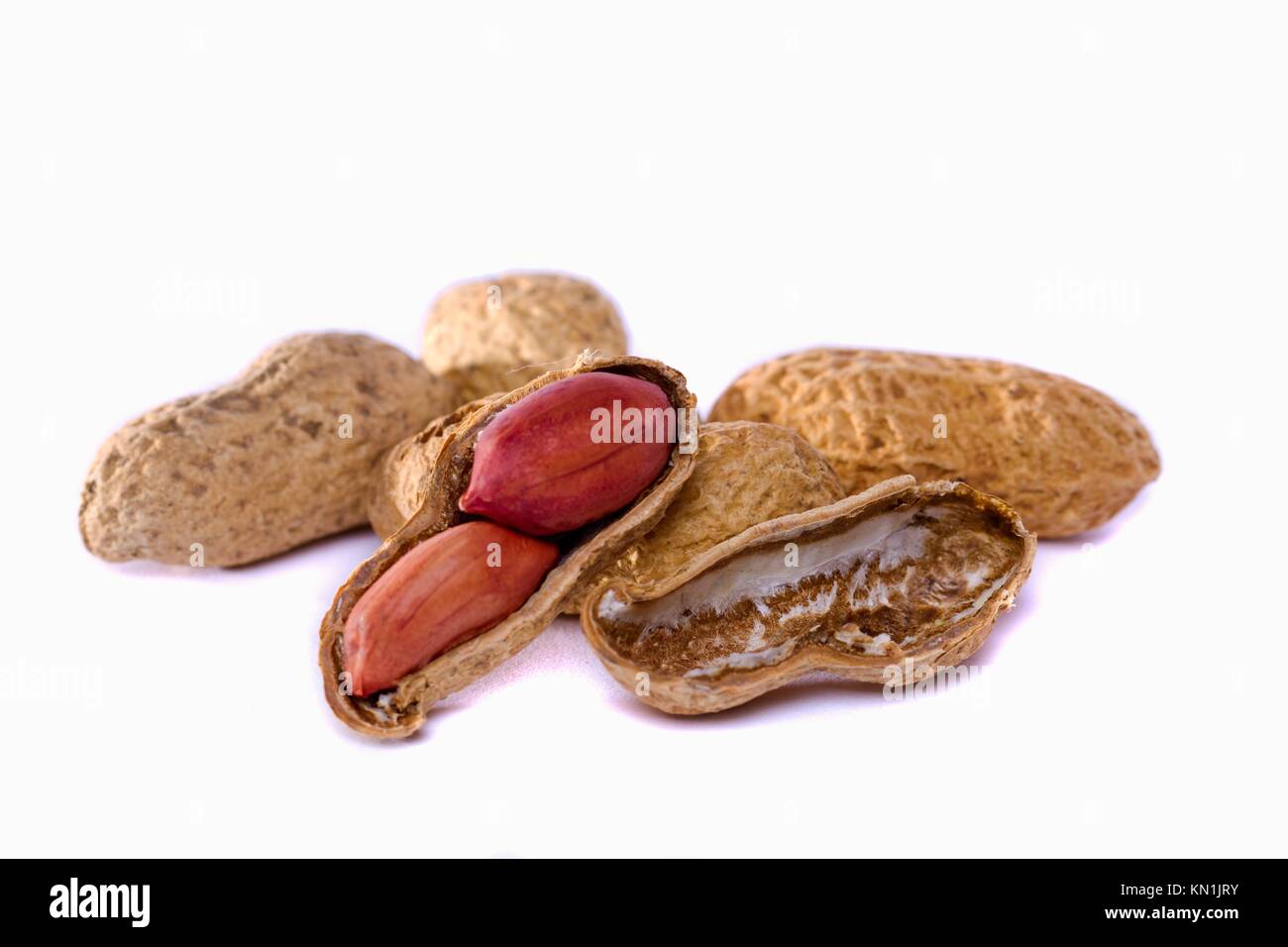 Close view detail of a bunch of peanuts on a white background Stock ...