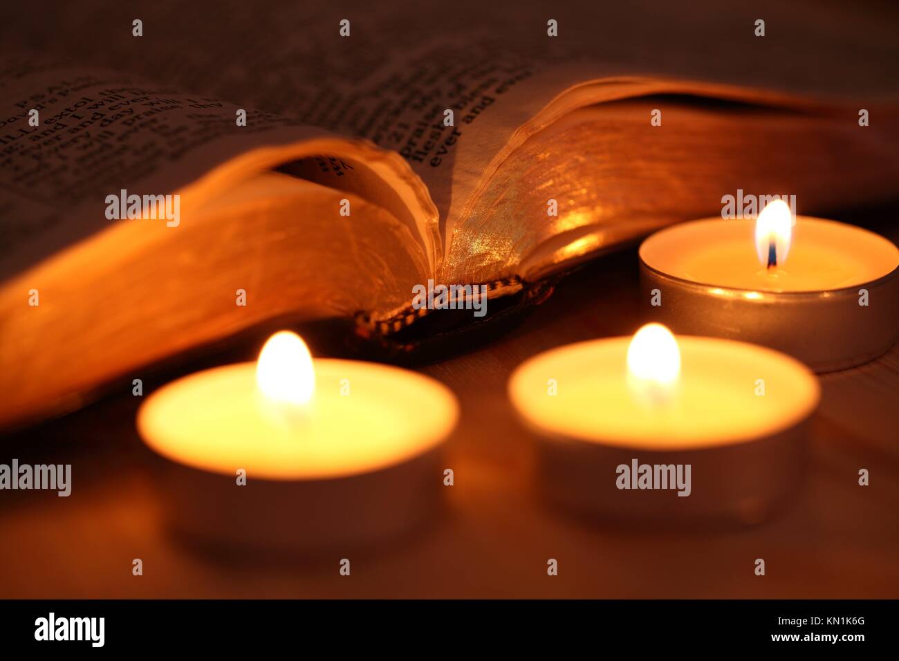 Open bible candles hi-res stock photography and images - Alamy