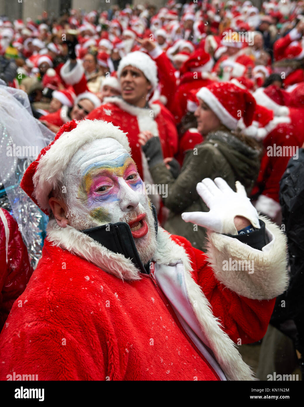 New York, USA, 9 Dec 2017. People dressed as Santa Claus pose for a ...
