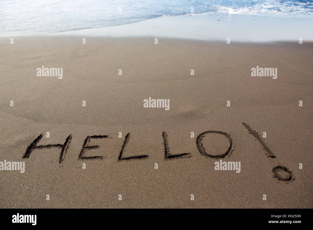 Brown sand beach with written word Hello in Canary Islands Stock Photo ...