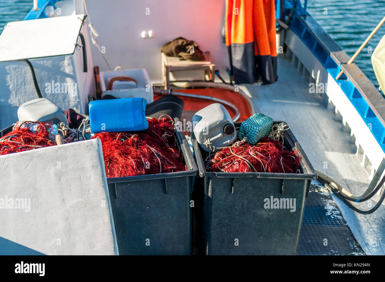 Fishing net on a small fishing boat Stock Photo - Alamy