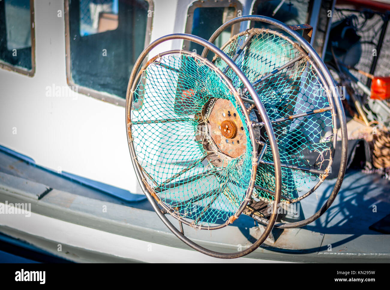Fishing net on a small fishing boat Stock Photo - Alamy