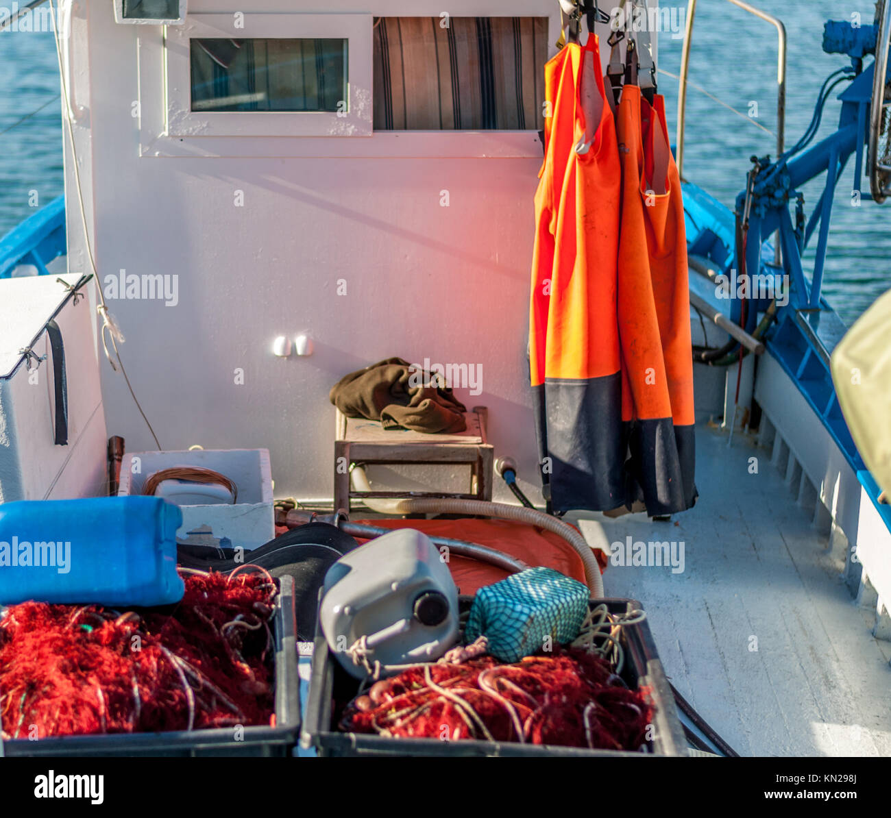 Fishing net on a small fishing boat Stock Photo - Alamy
