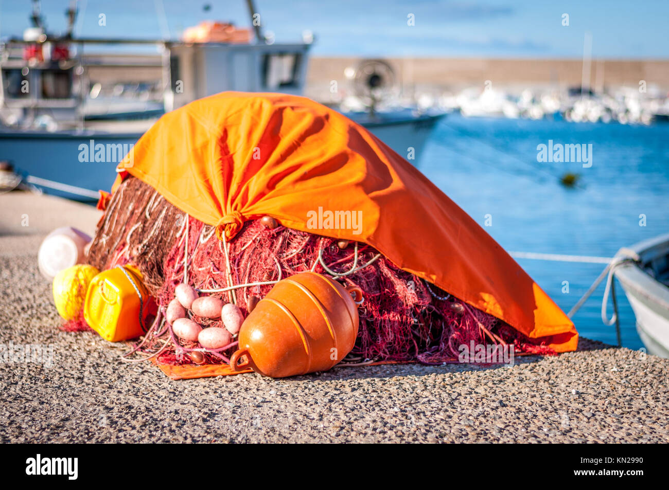 Closeup of orange and red fishing net on the harbor Stock Photo - Alamy