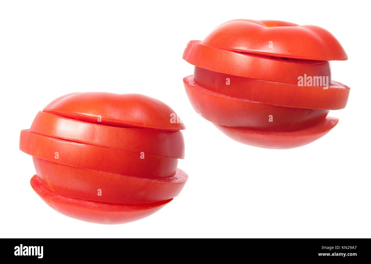 Stacks of Tomato Slices on White Background Stock Photo - Alamy