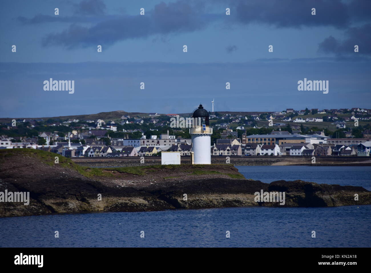 View from sea to Stornoway with Arnish Point Lighthouse in prominent in ...