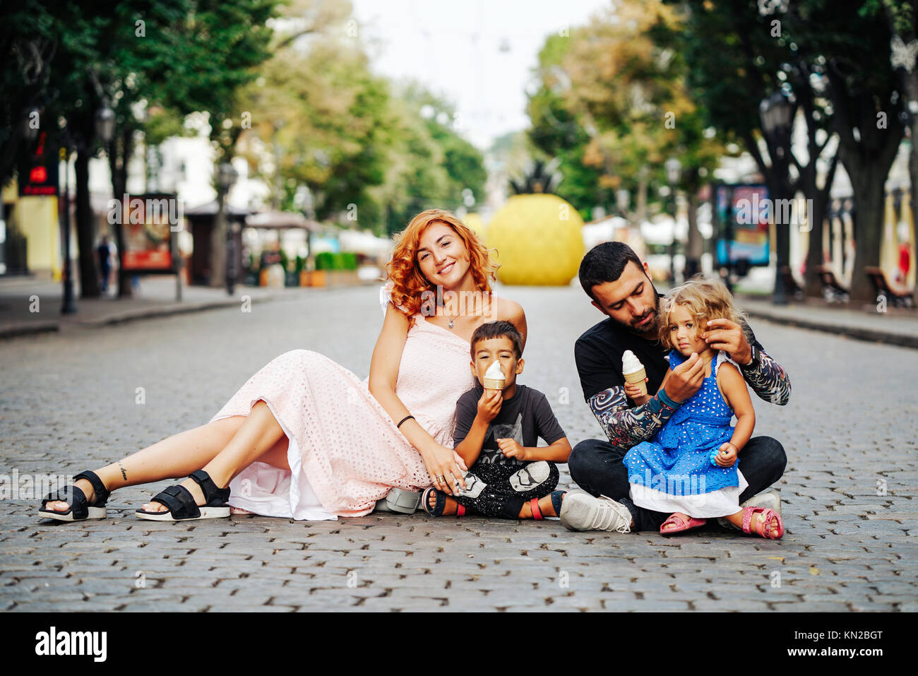 beautiful young family with ice cream Stock Photo - Alamy