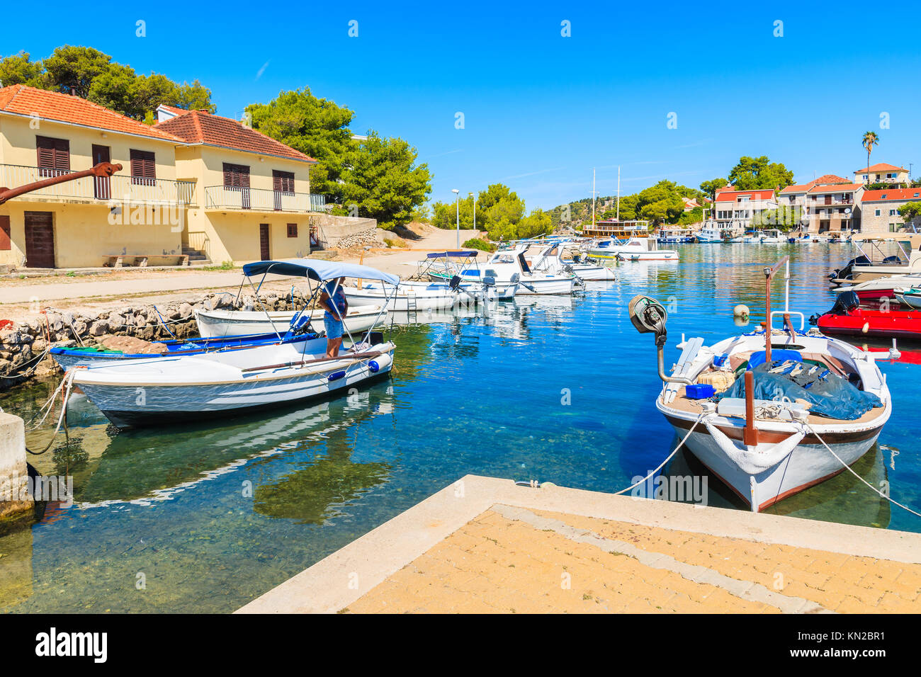 Fishing boats anchoring in small port of Razanj, Dalmatia, Croatia ...