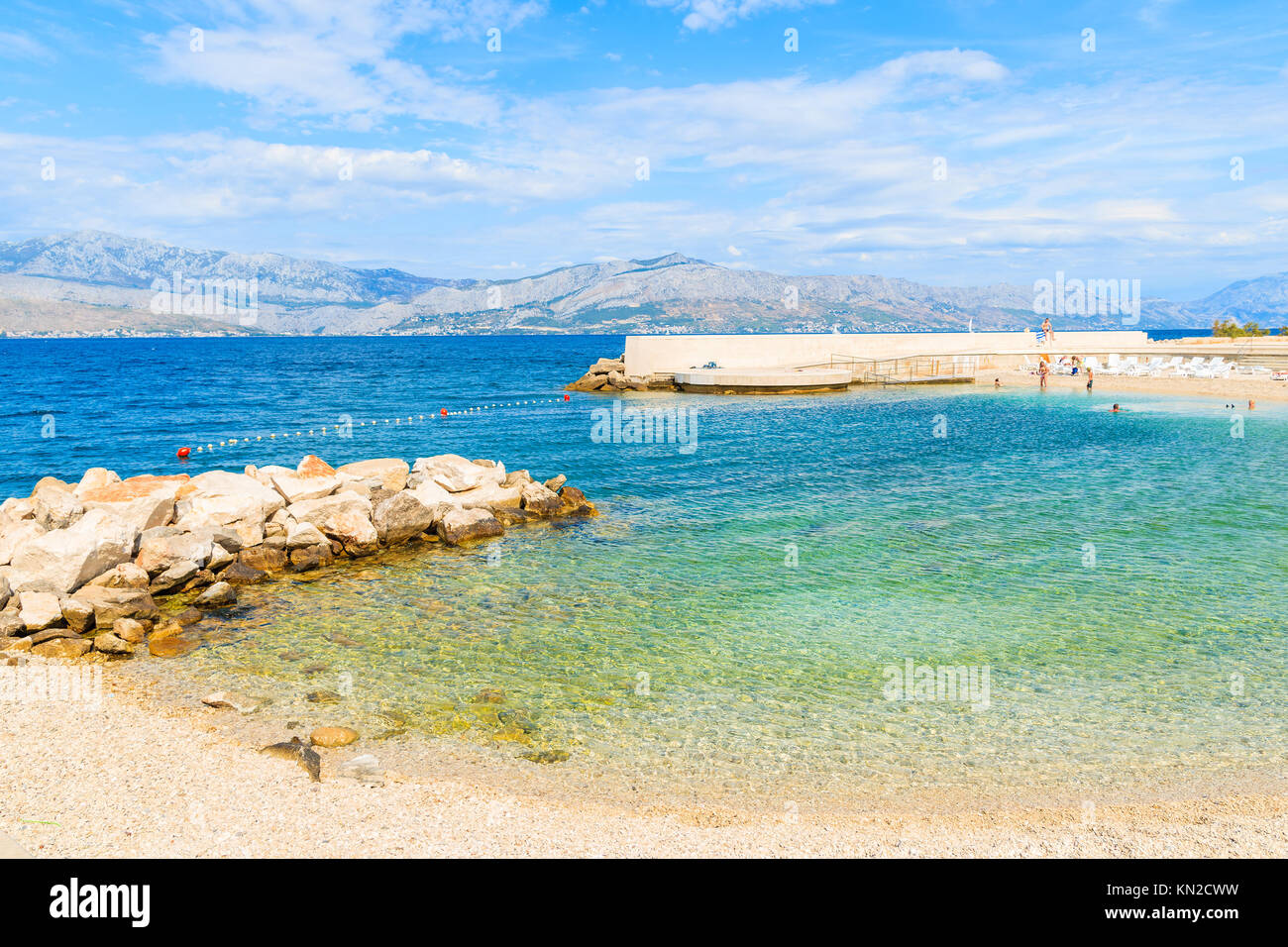 View of beach with turquoise sea water in Postira village, Brac island ...