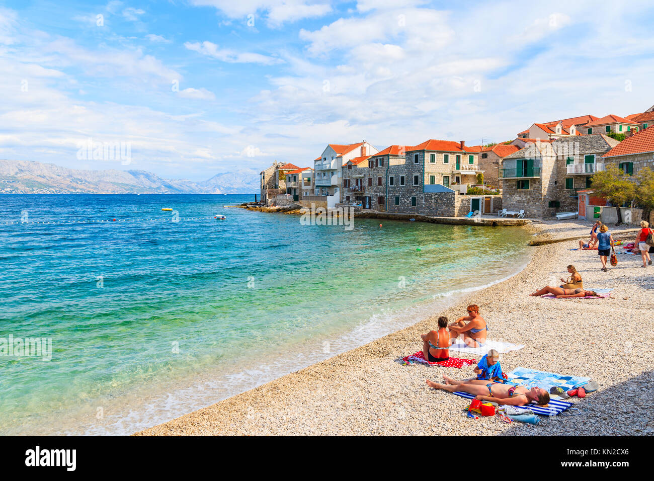 POSTIRA TOWN, BRAC ISLAND - SEP 7, 2017: tourists sunbathing on beach ...