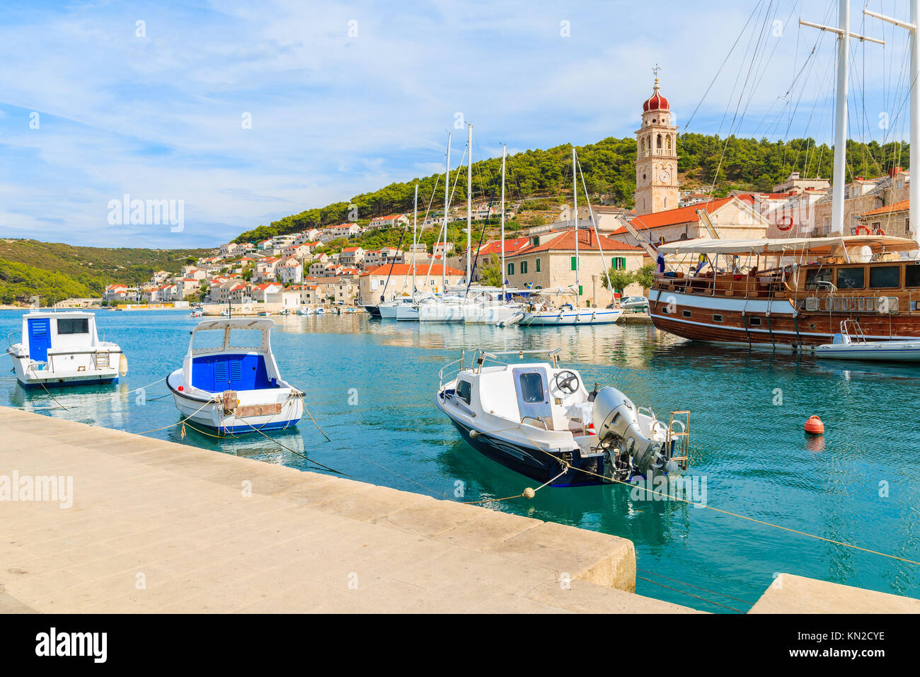 Fishing boat and wooden yacht in Pucisca port, Brac island, Croatia ...