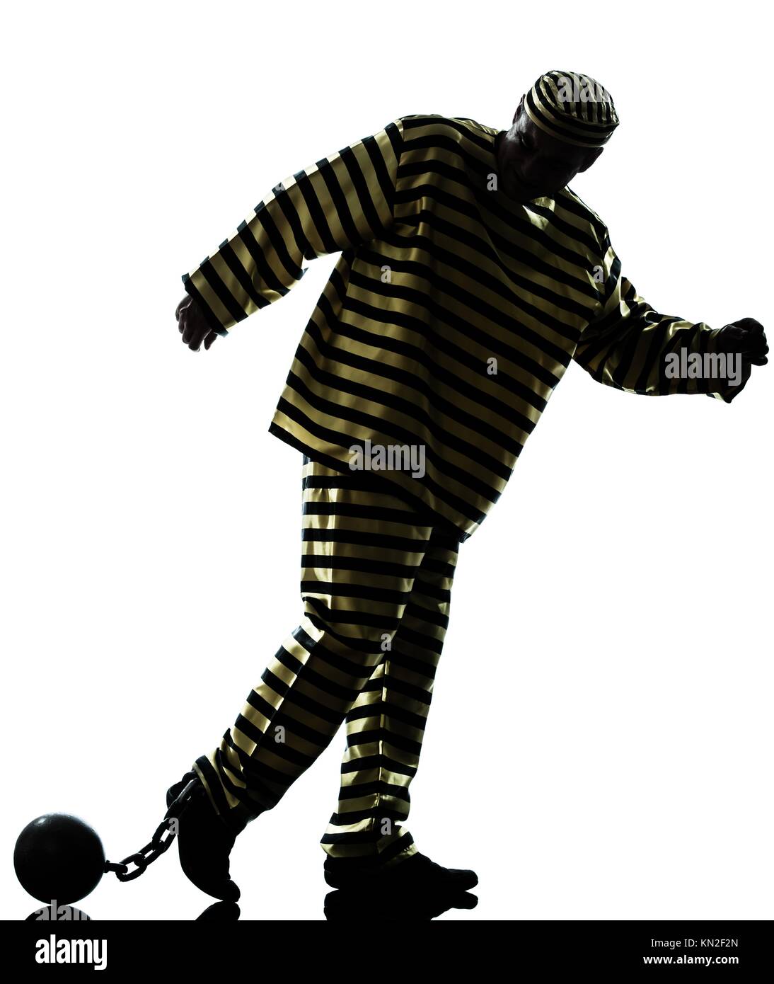 one caucasian man prisoner criminal with chain ball in studio isolated ...