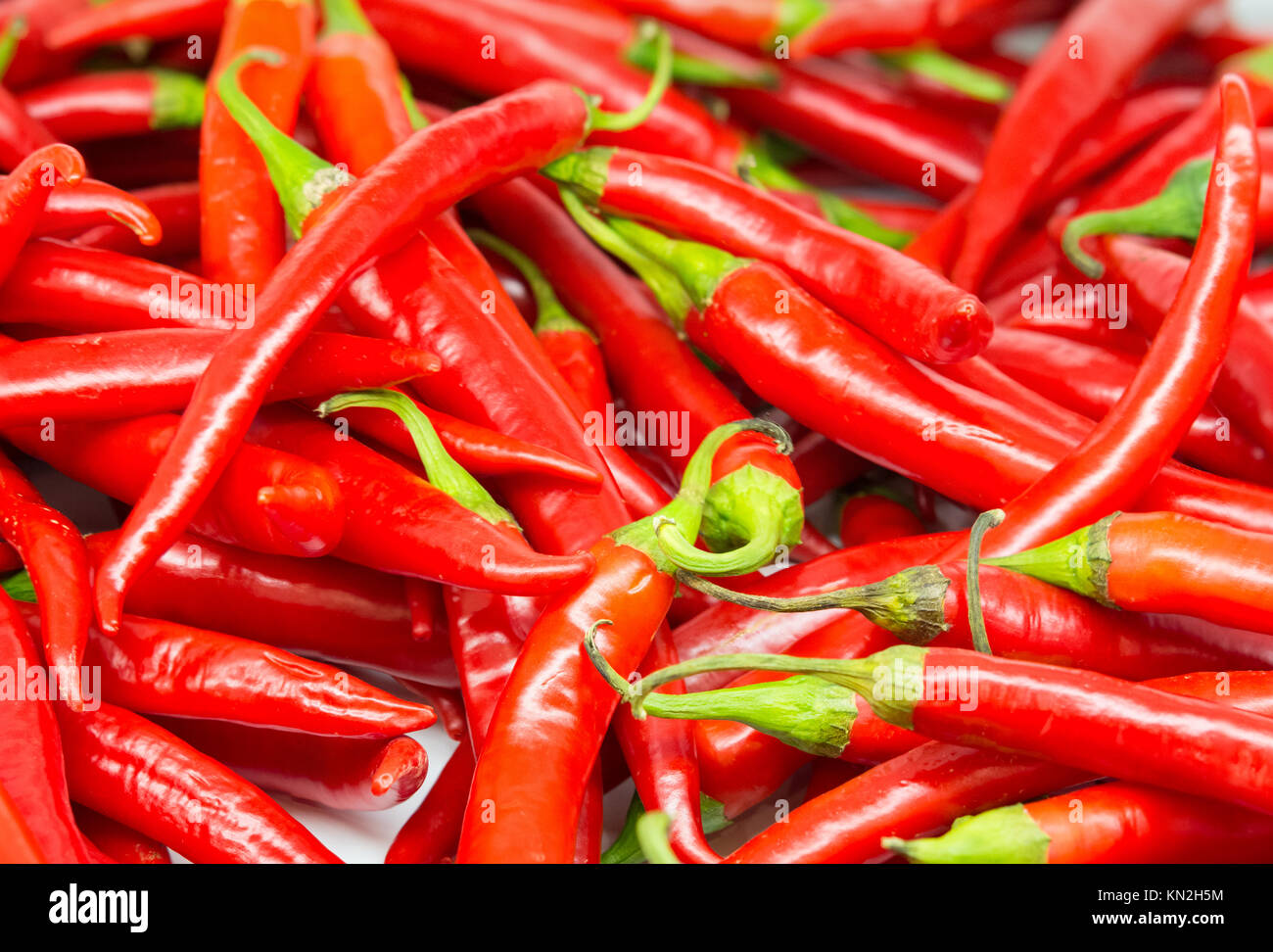Red hot peppers with a price tag on the counter Stock Photo - Alamy