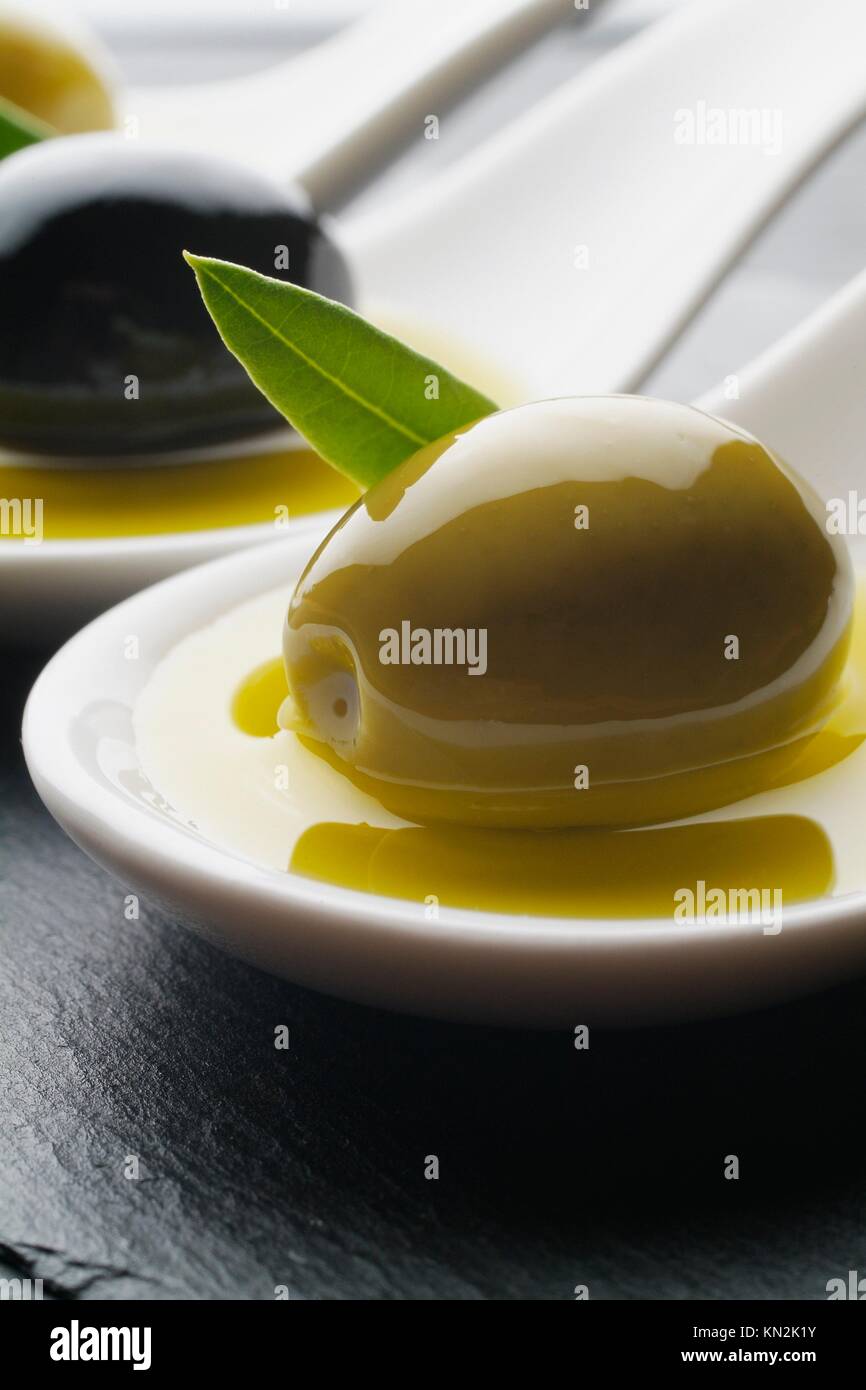 tasting olives and virgin olive oil Stock Photo - Alamy