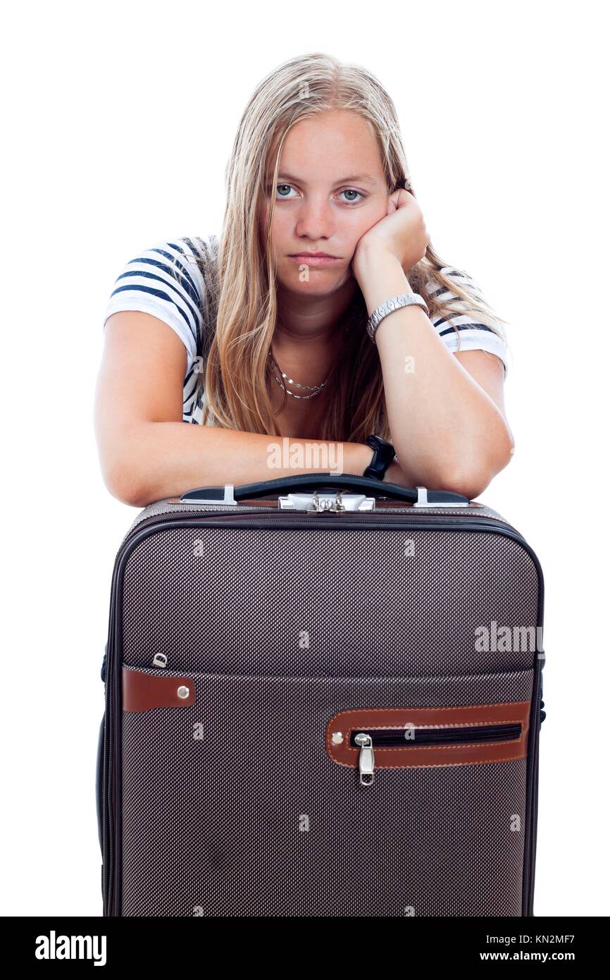 Bored young traveller tourist woman waiting with luggage, isolated on ...