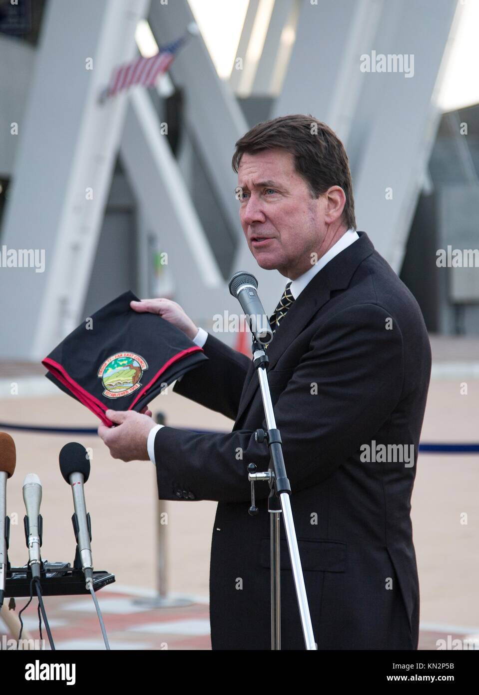 U.S. Ambassador to Japan William Hagerty holds up a handkerchief ...