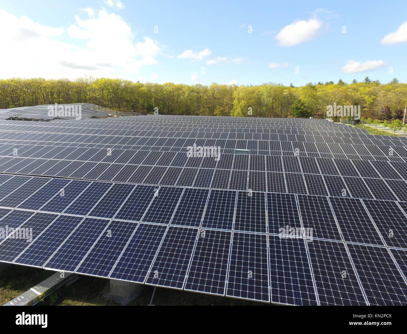 A solar panel farm is built on top of an unused landfill property May ...