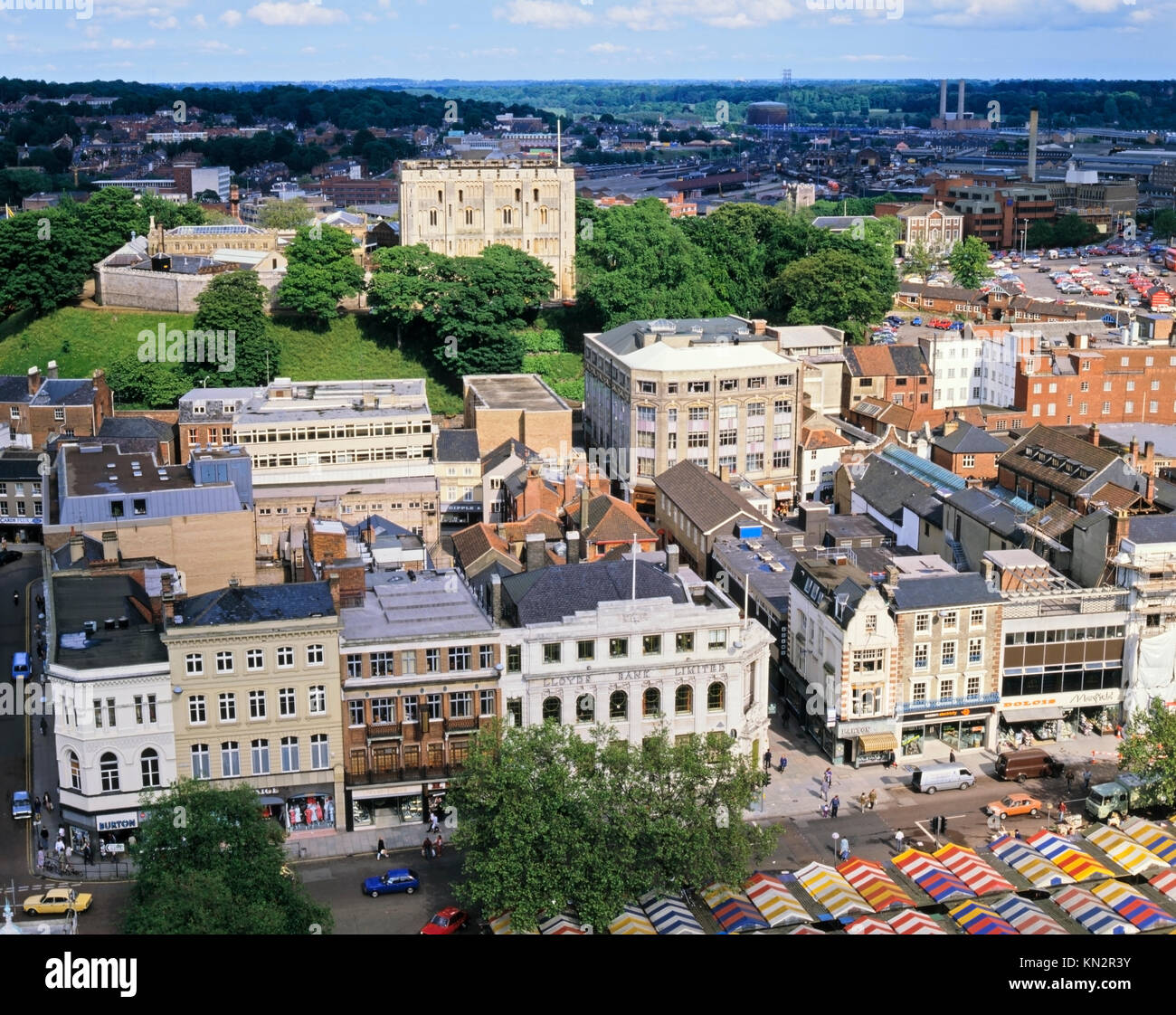 Norwich City with shops and market below and castle with surrounding ...