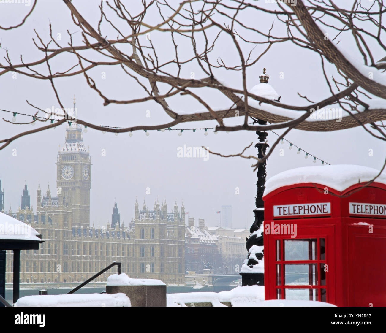 Palace of Westminster covered in snow, with the iconic British red ...